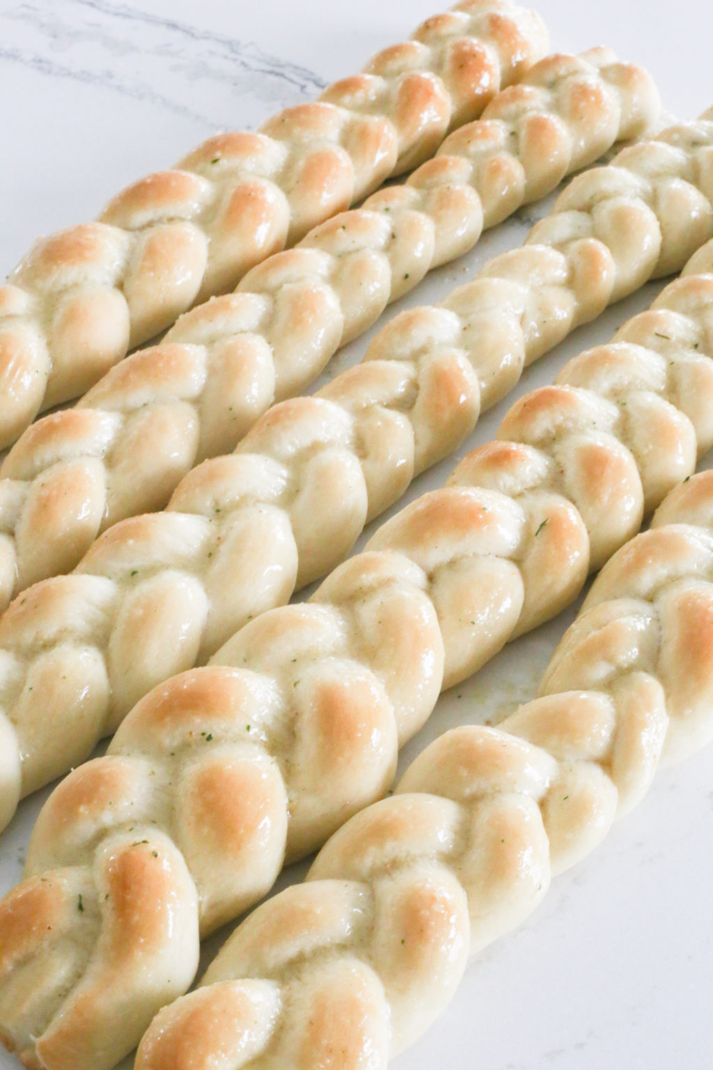 Mouth-Watering Braided Garlic Breadstick Recipe - The Unlikely Hostess